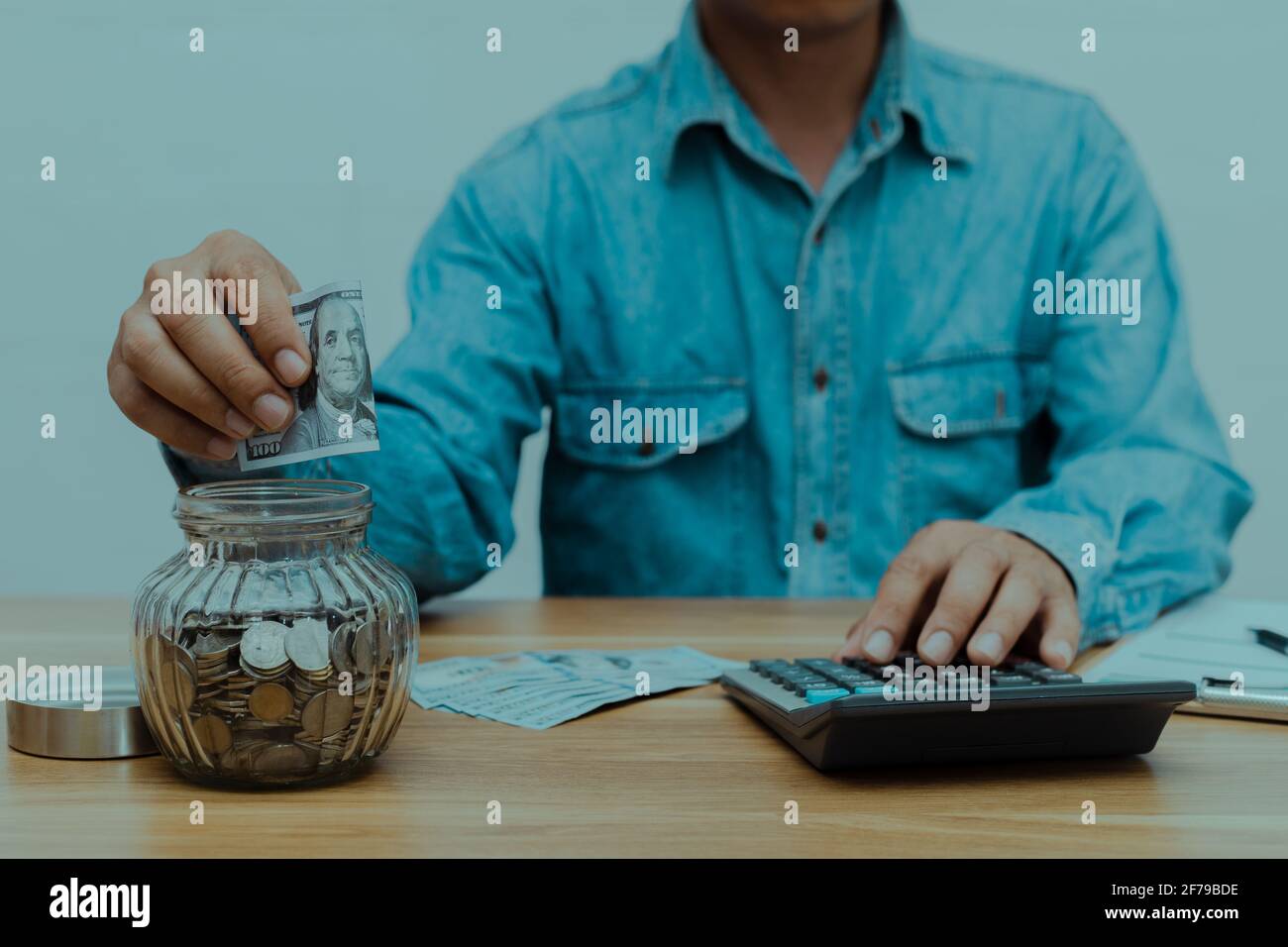 A man with a dollar Money saving ideas Stock Photo - Alamy