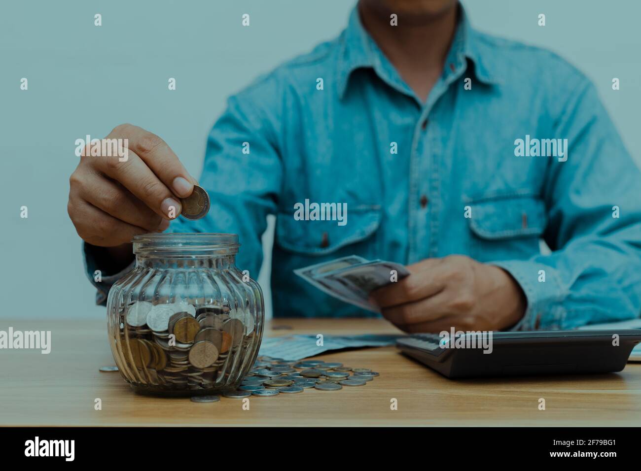 A man with a dollar Money saving ideas Stock Photo - Alamy