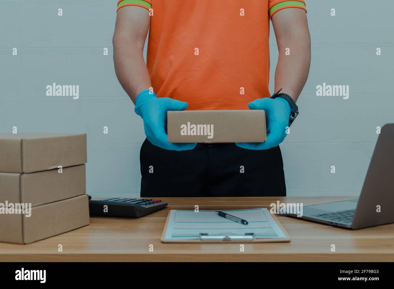 A parcel delivery worker counting the parcel boxes Stock Photo - Alamy
