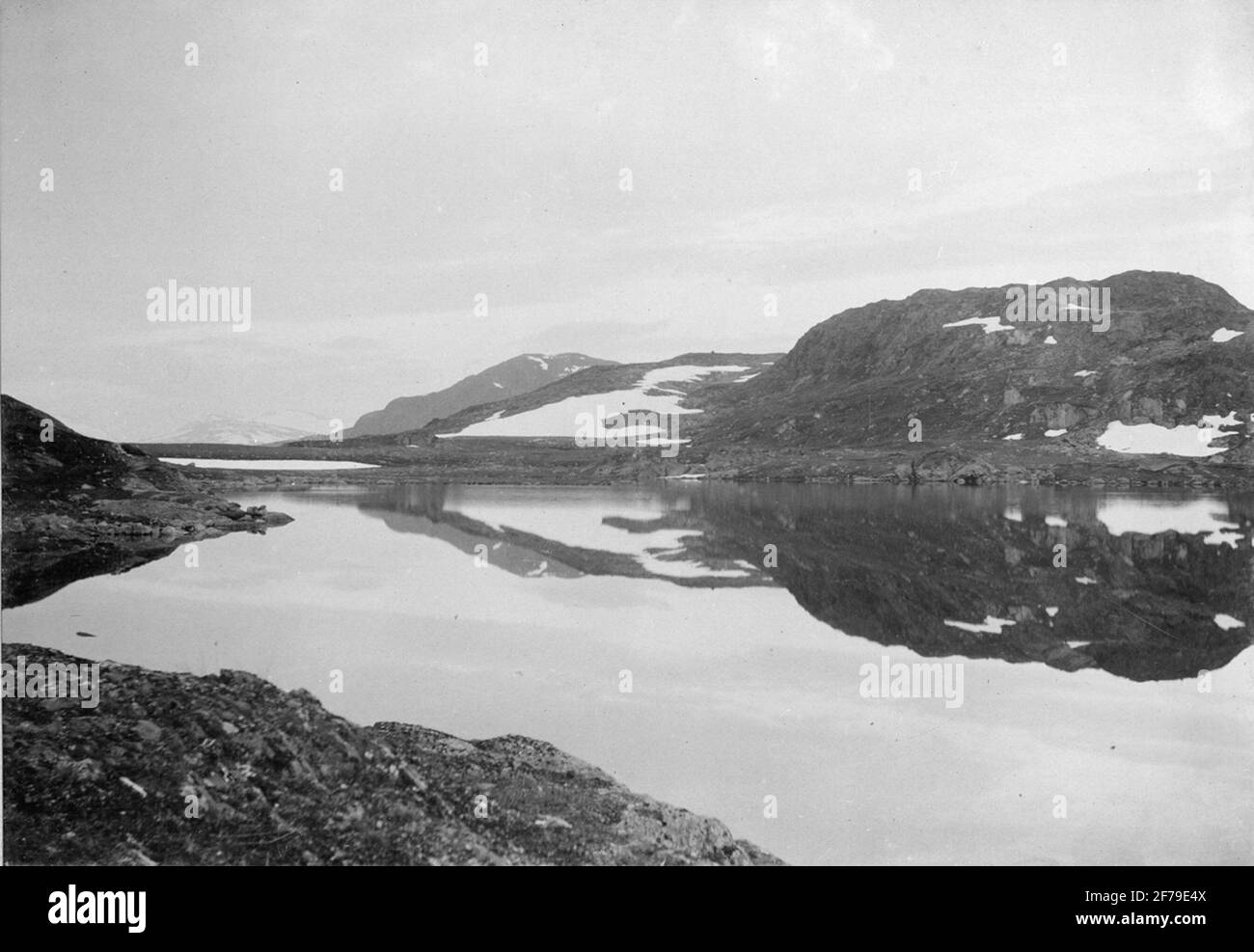 Sjangeli copper grapes in Lapland. View of mountain lake Stock Photo ...