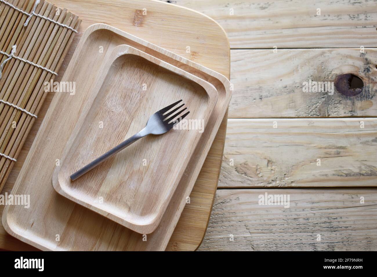 Wooden tray and fork Stock Photo - Alamy