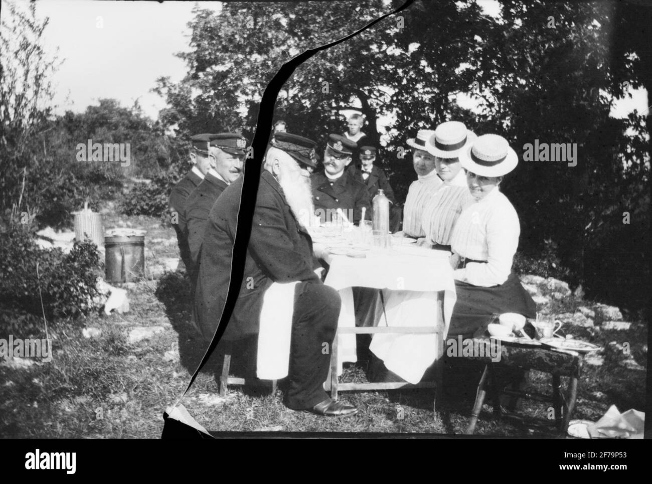 Queen Victoria's pictures. Company around dining table in garden. His ...