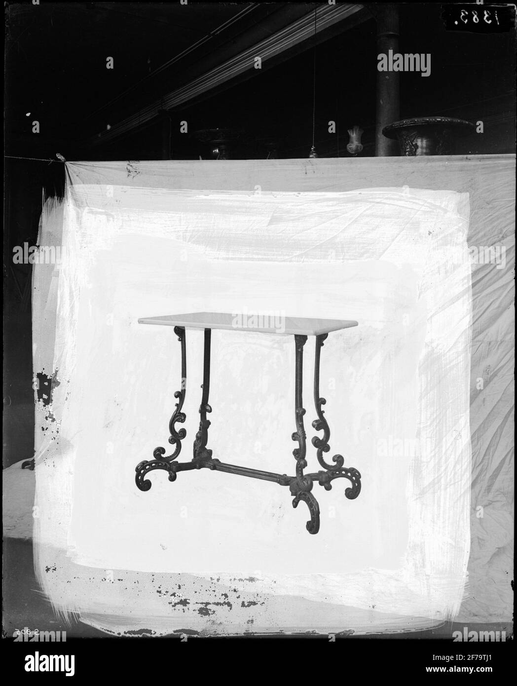 Table with cast iron stand Stock Photo - Alamy