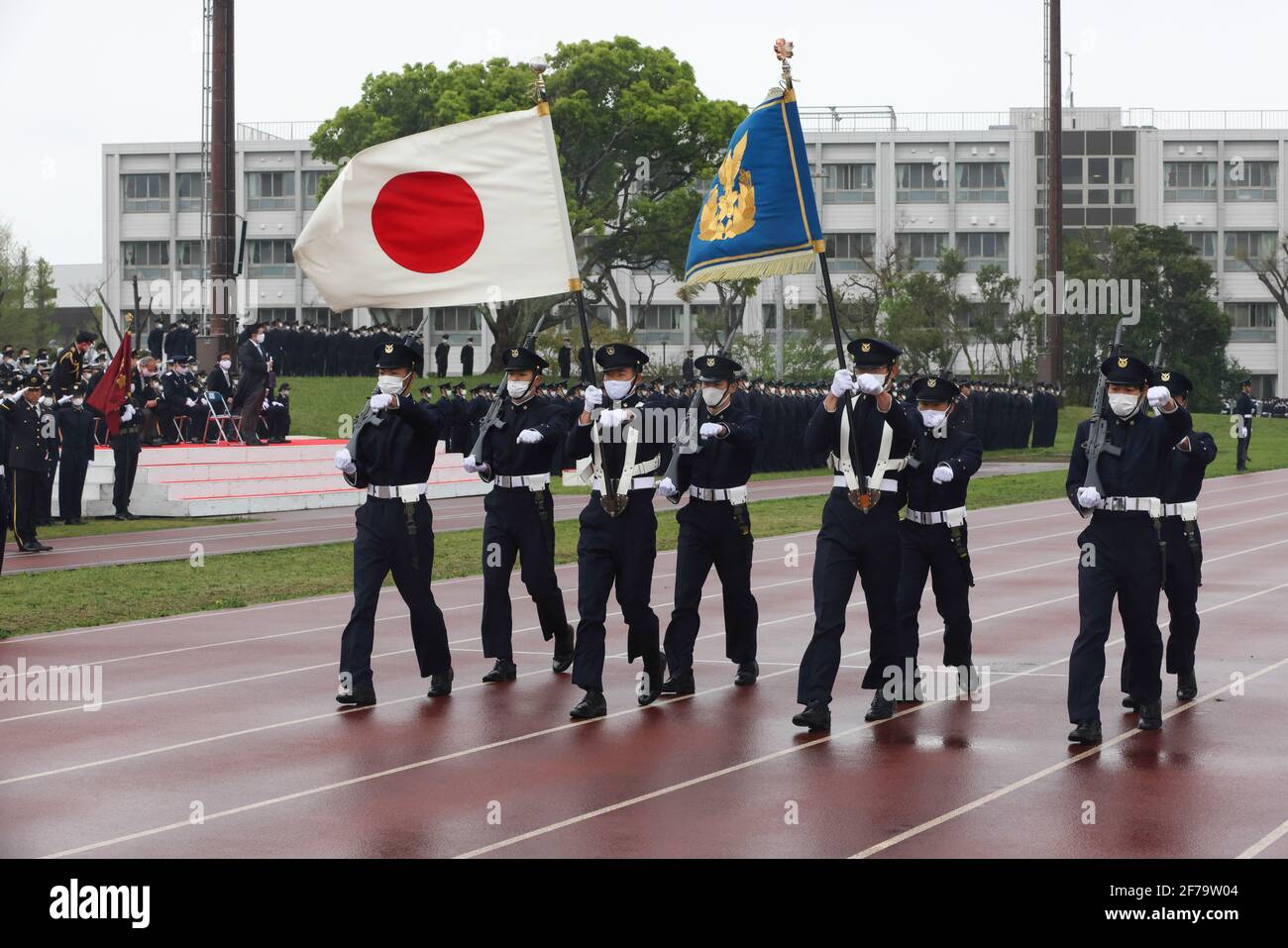 Students of the National Defense Academy hold the Japanese flag ...