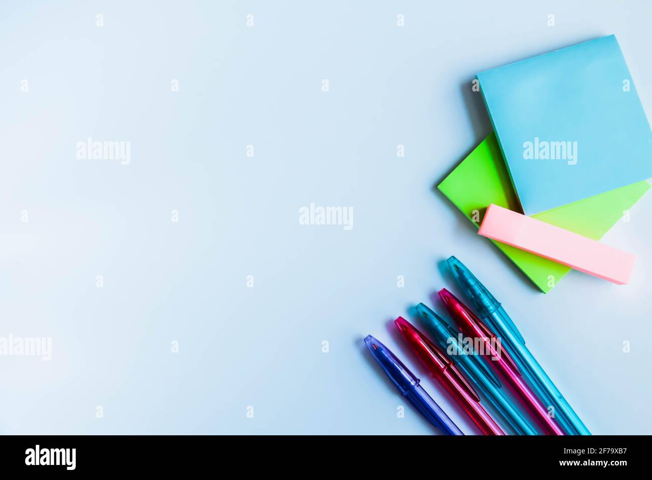 Paper notes and colorful pens. Stickers for taking notes on a white ...