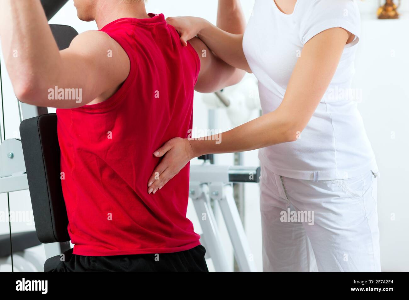 Patient at the physiotherapy making physical exercises with his ...