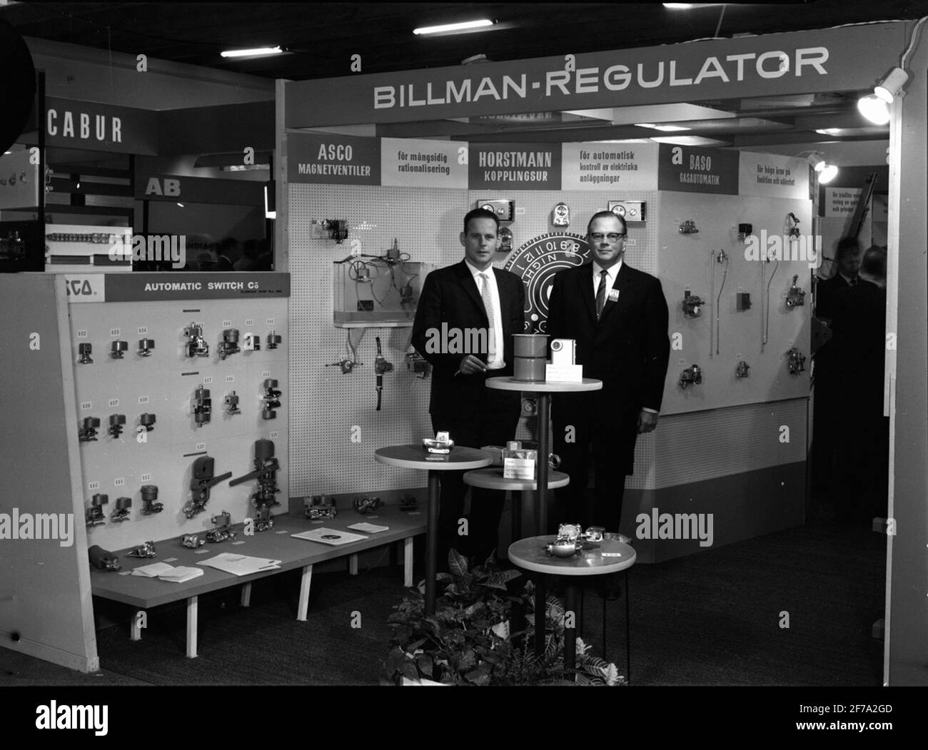 The Technical Fair. Two men in Billman regulators booth Stock Photo - Alamy