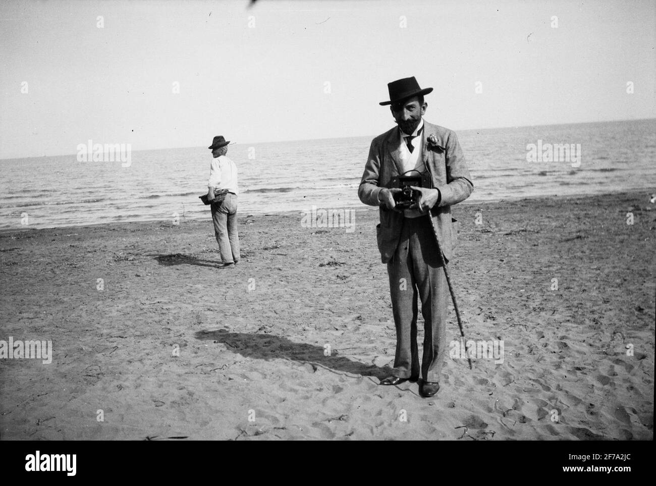 Queen Victoria's pictures. Two unknown men on a beach Stock Photo - Alamy