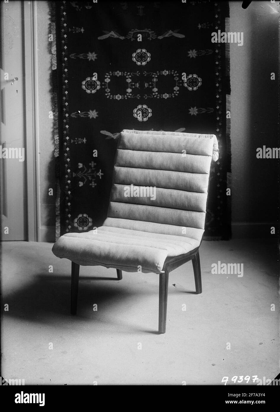 The craft's propaganda exhibition: chair with carpet in the background ...