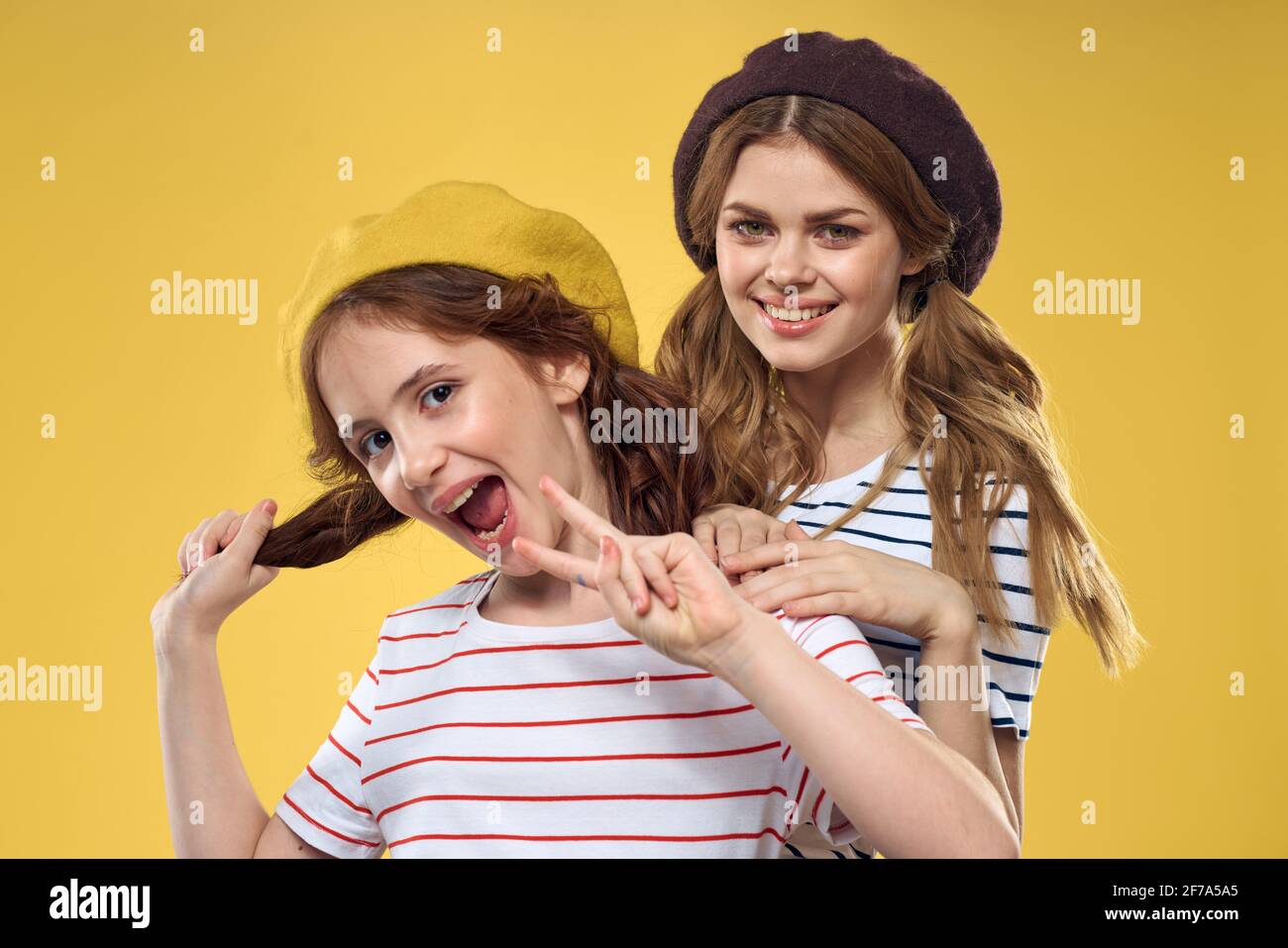 funny mom and daughter wearing hats fashion fun joy family yellow ...
