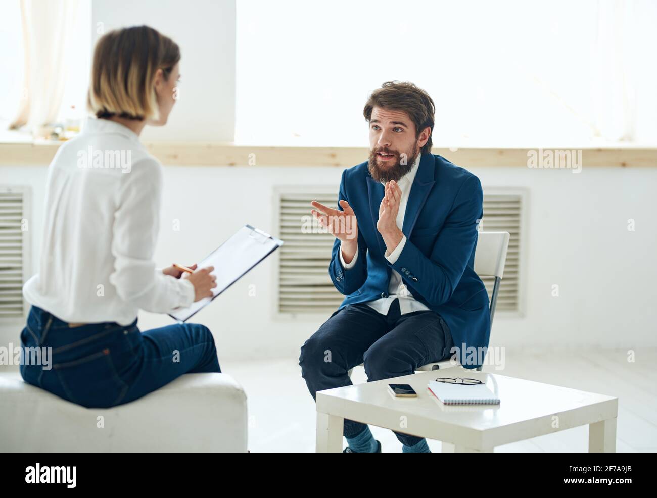 A man at the reception of a psychologist communication consultation ...