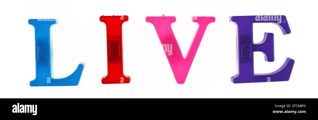 The word live is lined with multicolored plastic letters isolated on ...