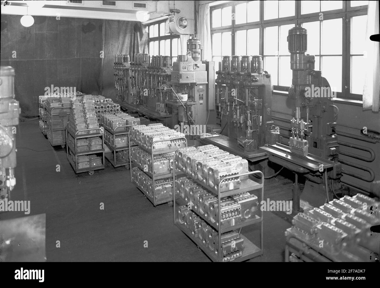 Serial manufacturing of machine parts Stock Photo - Alamy