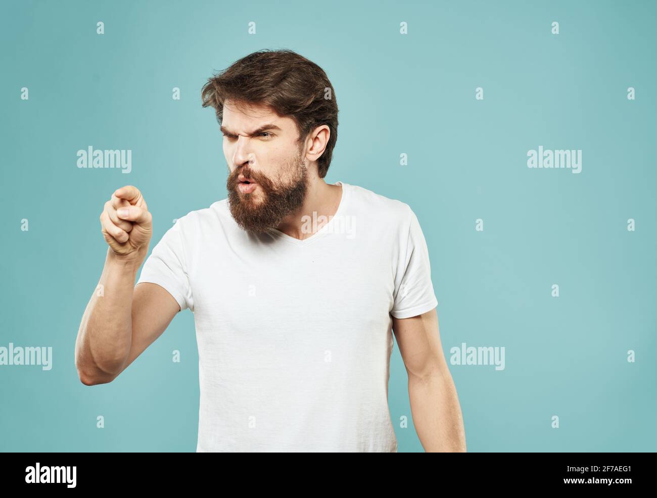Aggressive man emotions and stress irritability blue background Stock ...