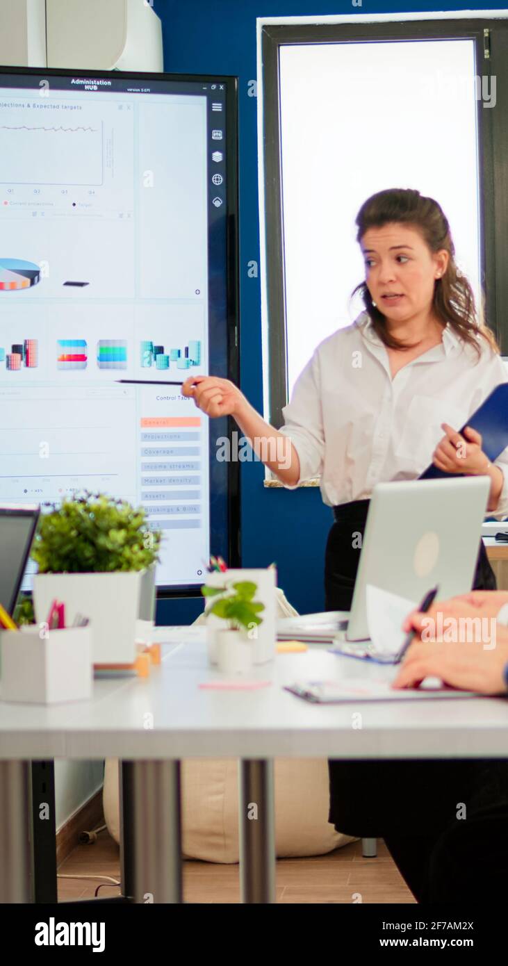 Female executive leader coach presenter giving financial presentation ...