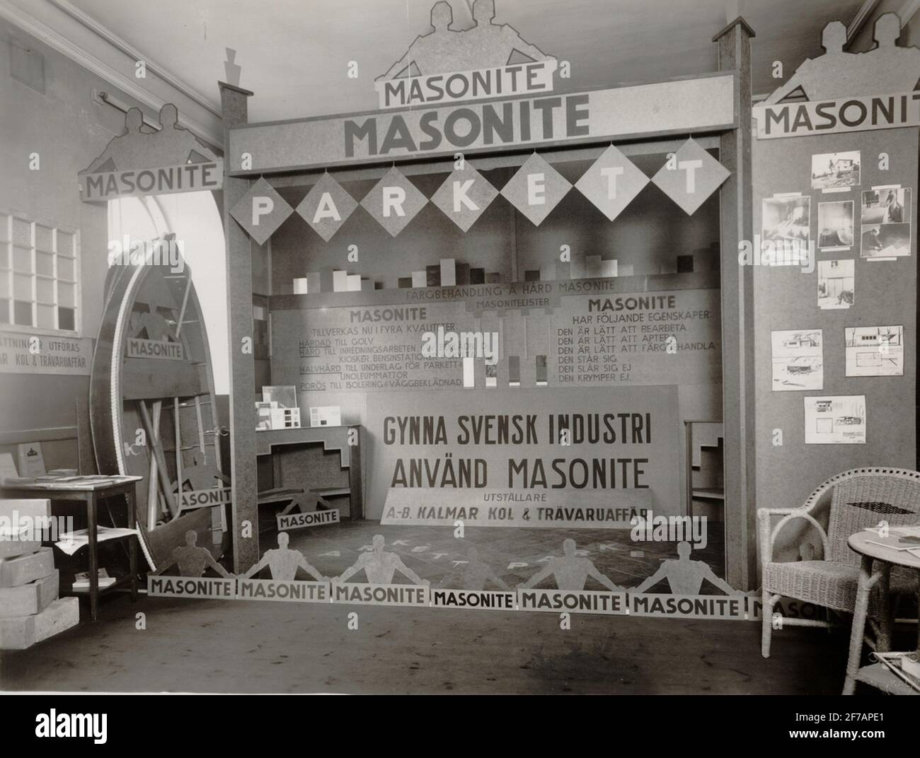 Masonite. AB Kalmar Coal & Trävaruhandel's booth on the building and ...