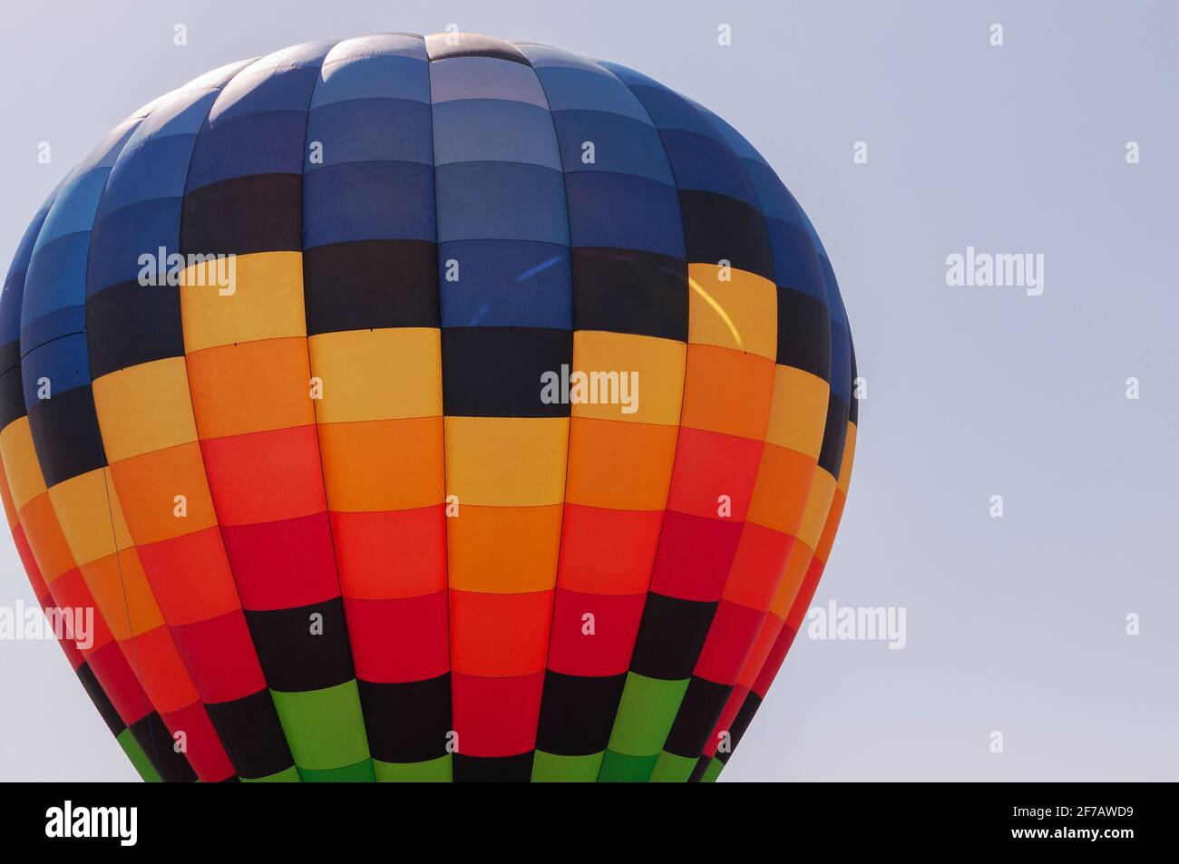 Blue, orange, yellow, green are the colors of a huge parachute. The ...