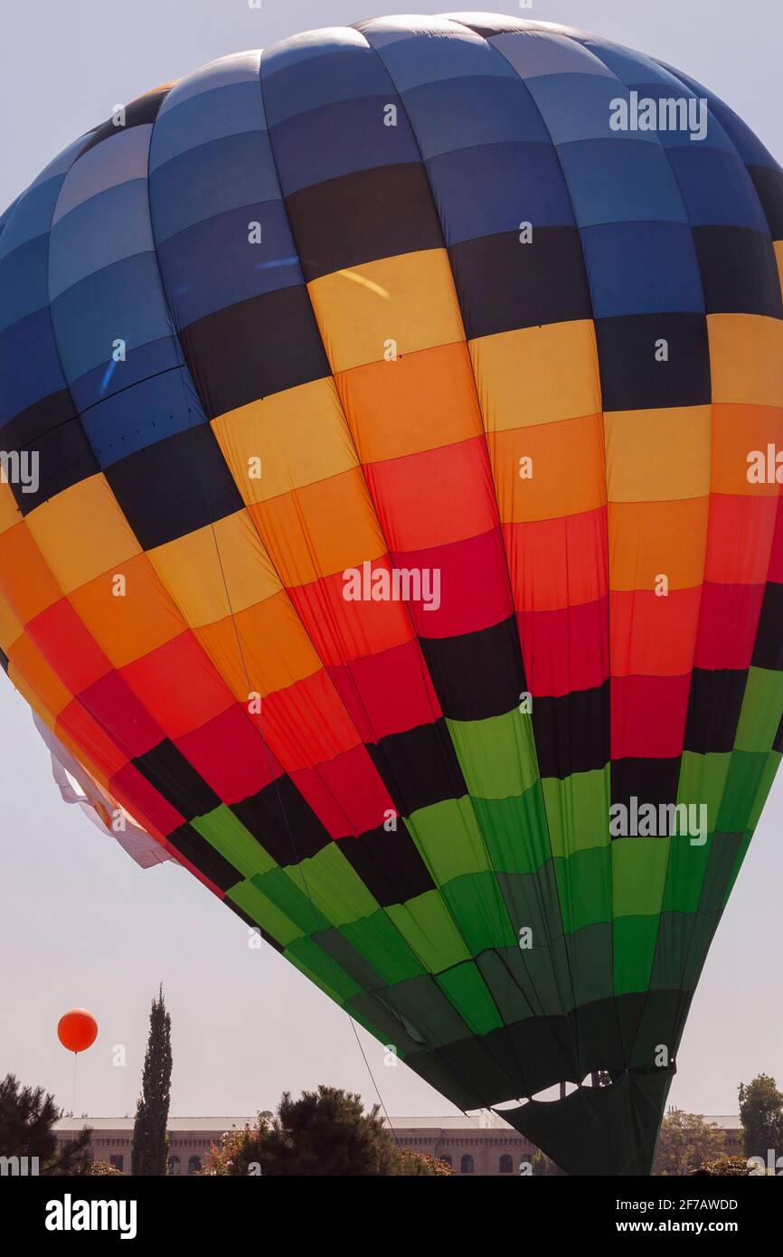 Blue, orange, yellow, green are the colors of a huge parachute. The ...