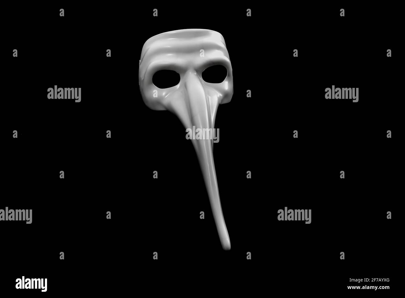 White mask with long nose is isolated on black background. The face of ...