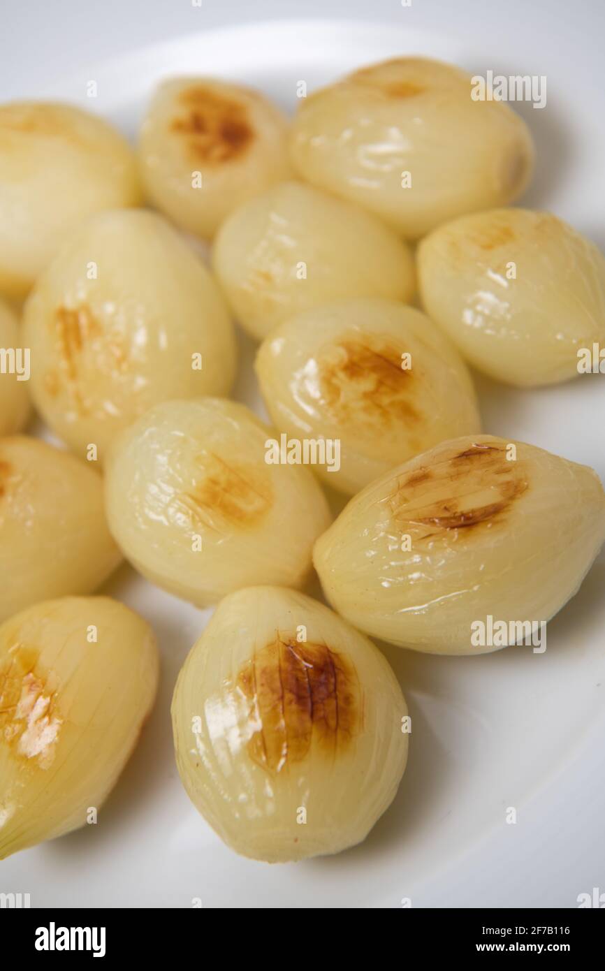Preparing fresh white onions cooked on plate Stock Photo - Alamy