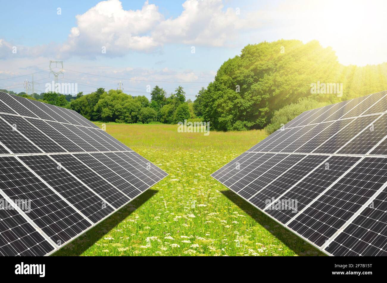 Solar energy panels on meadow. Sustainable resources Stock Photo - Alamy
