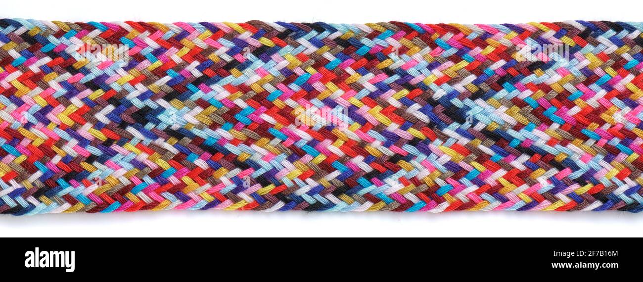A braid of multi colored sewing threads on a white background Stock ...