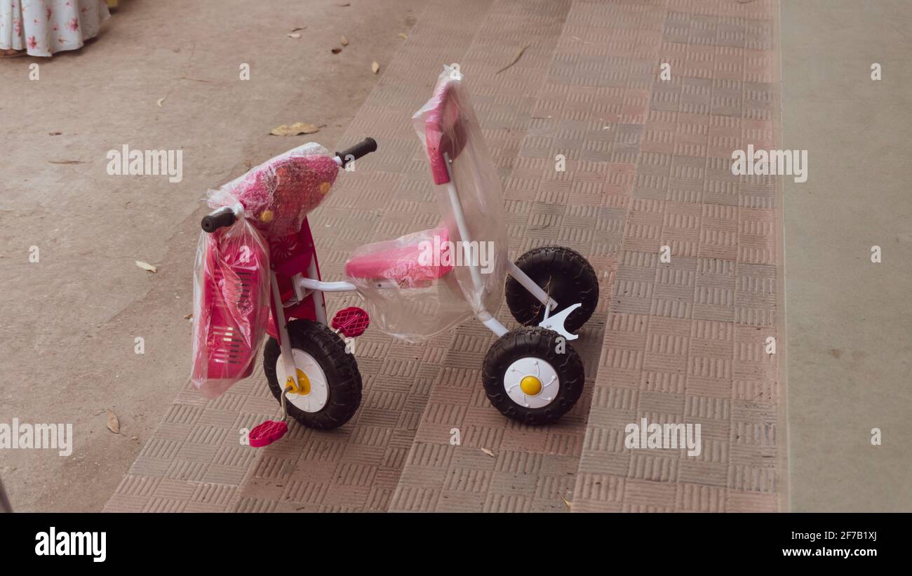Baby riding tricycle hi-res stock photography and images - Alamy