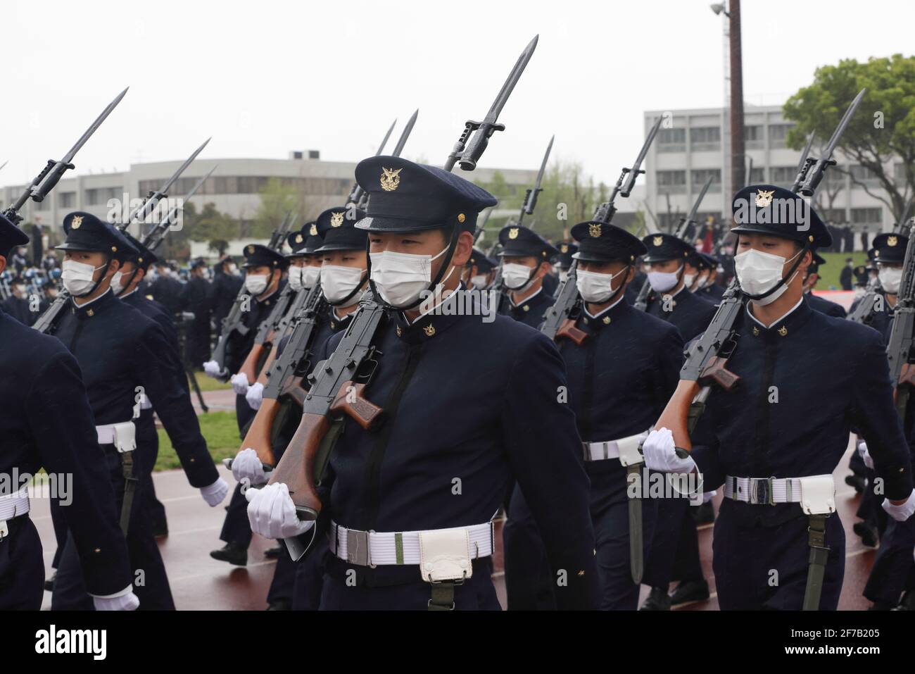 Students of the National Defense Academy perform a military parade to ...