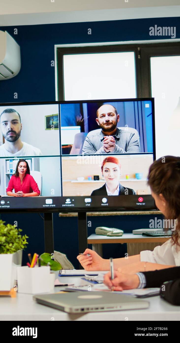 Headshot screen application view of remote multiracial employees ...