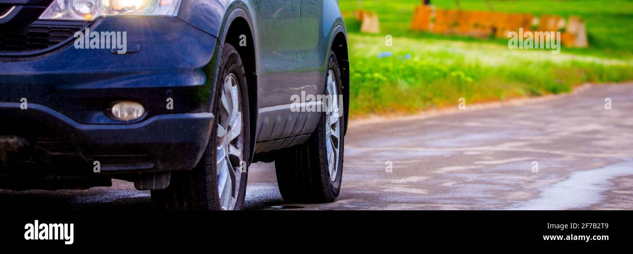 Car by the asphalt road wide and far view Stock Photo - Alamy