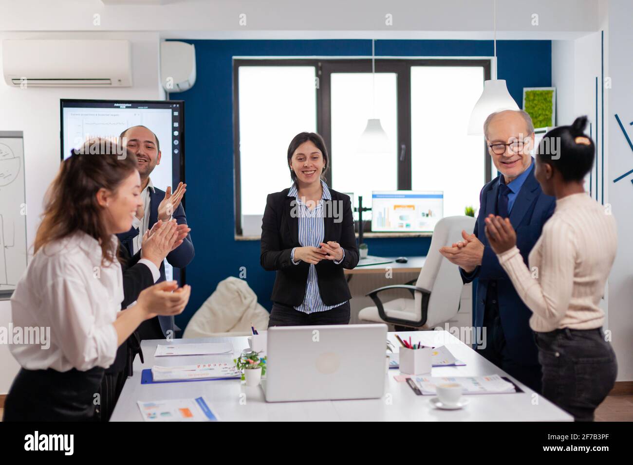 Happy creative business team having meeting in broadroom office victory ...