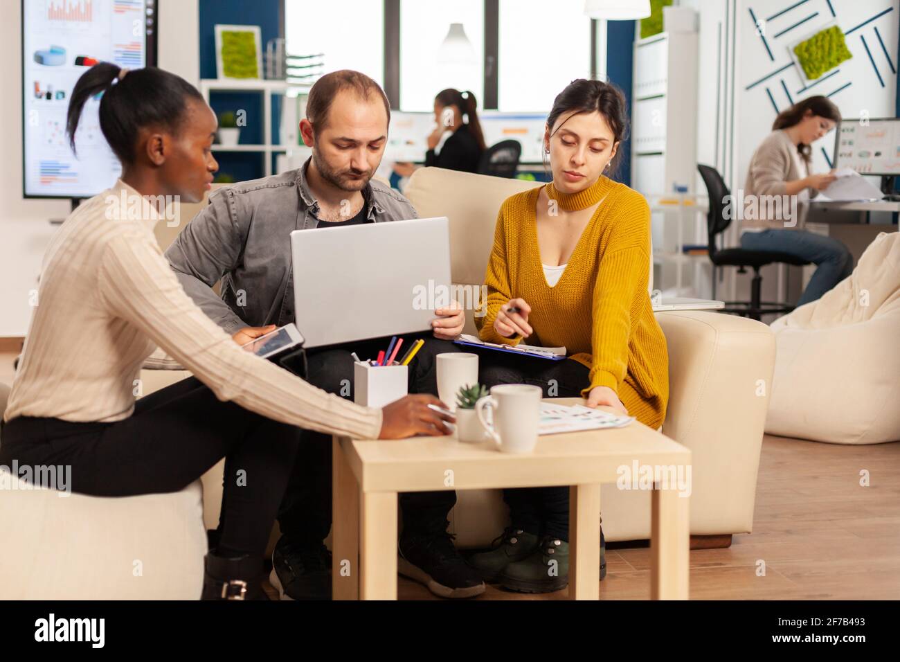 Group of diverse startup company colleague entrepreneur sitting on ...