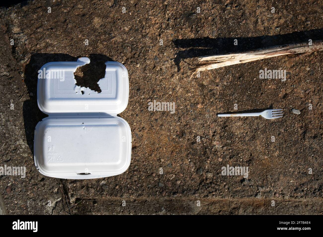 broken fast food polystyrene box on ground outdoors Stock Photo - Alamy