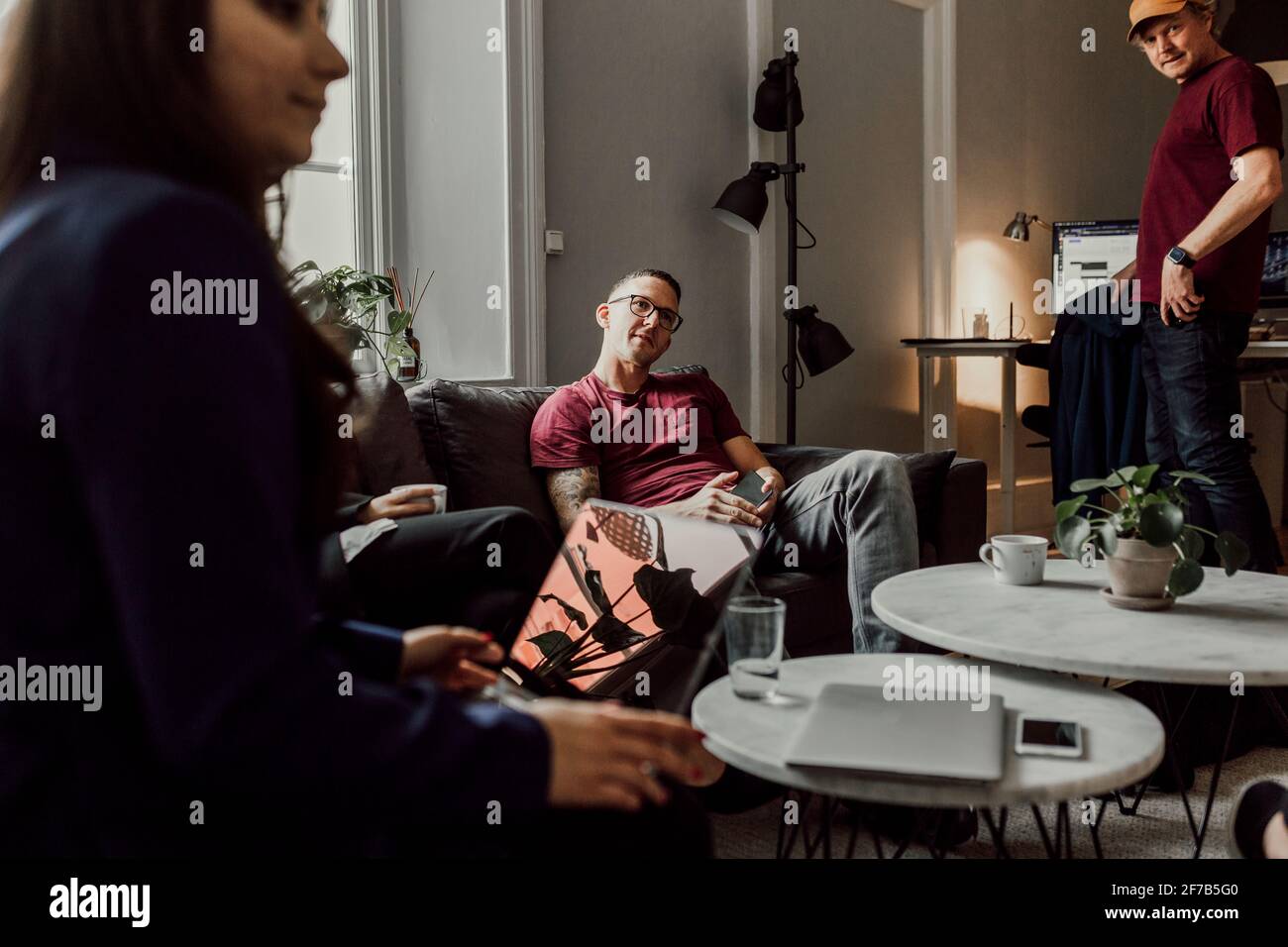 Coworkers talking during meeting Stock Photo - Alamy