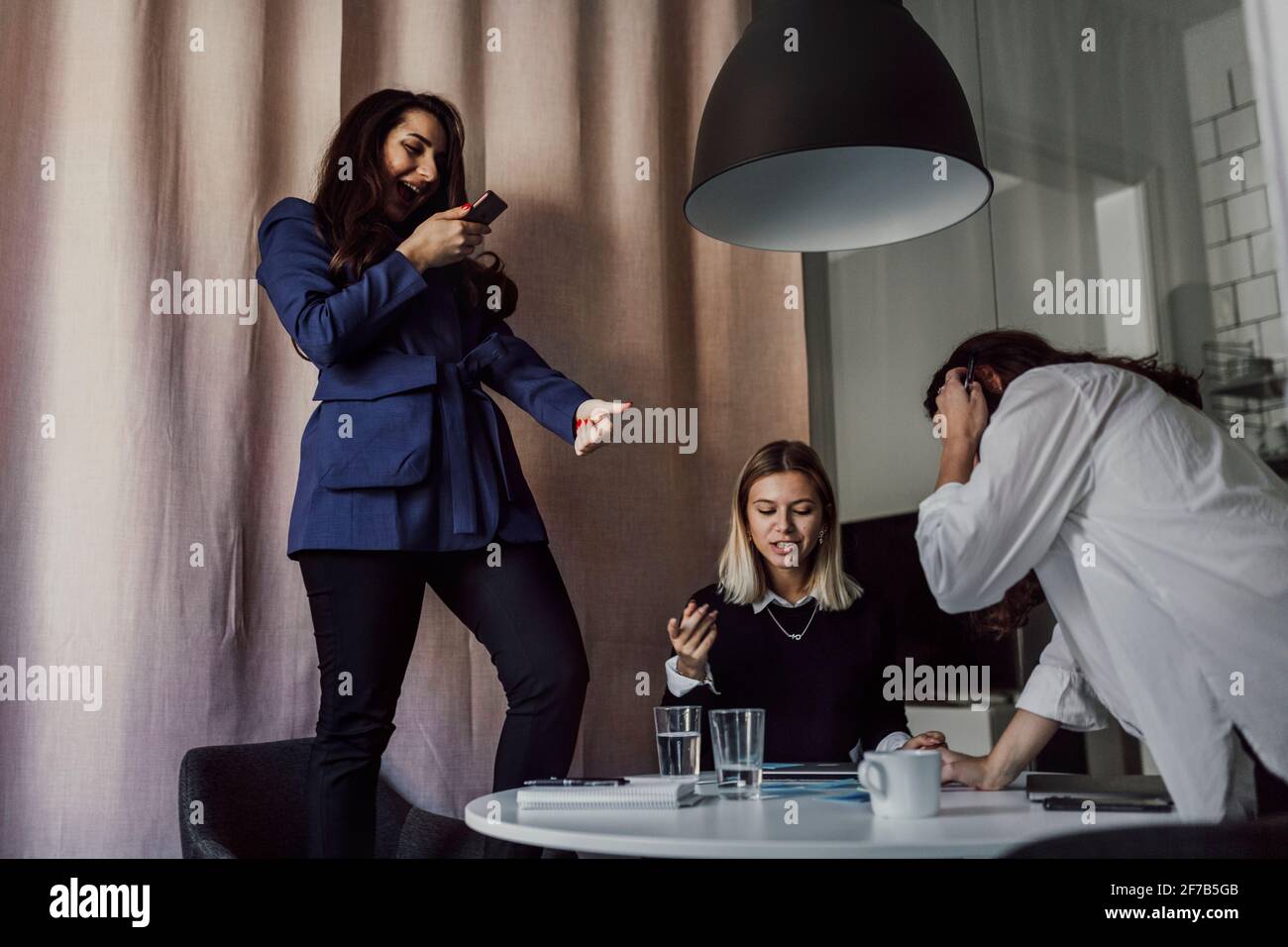 Happy female keyworkers at work Stock Photo - Alamy