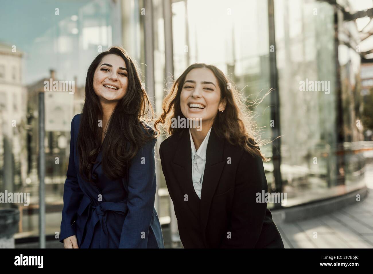 Professional looking business woman in front of office building hi-res ...