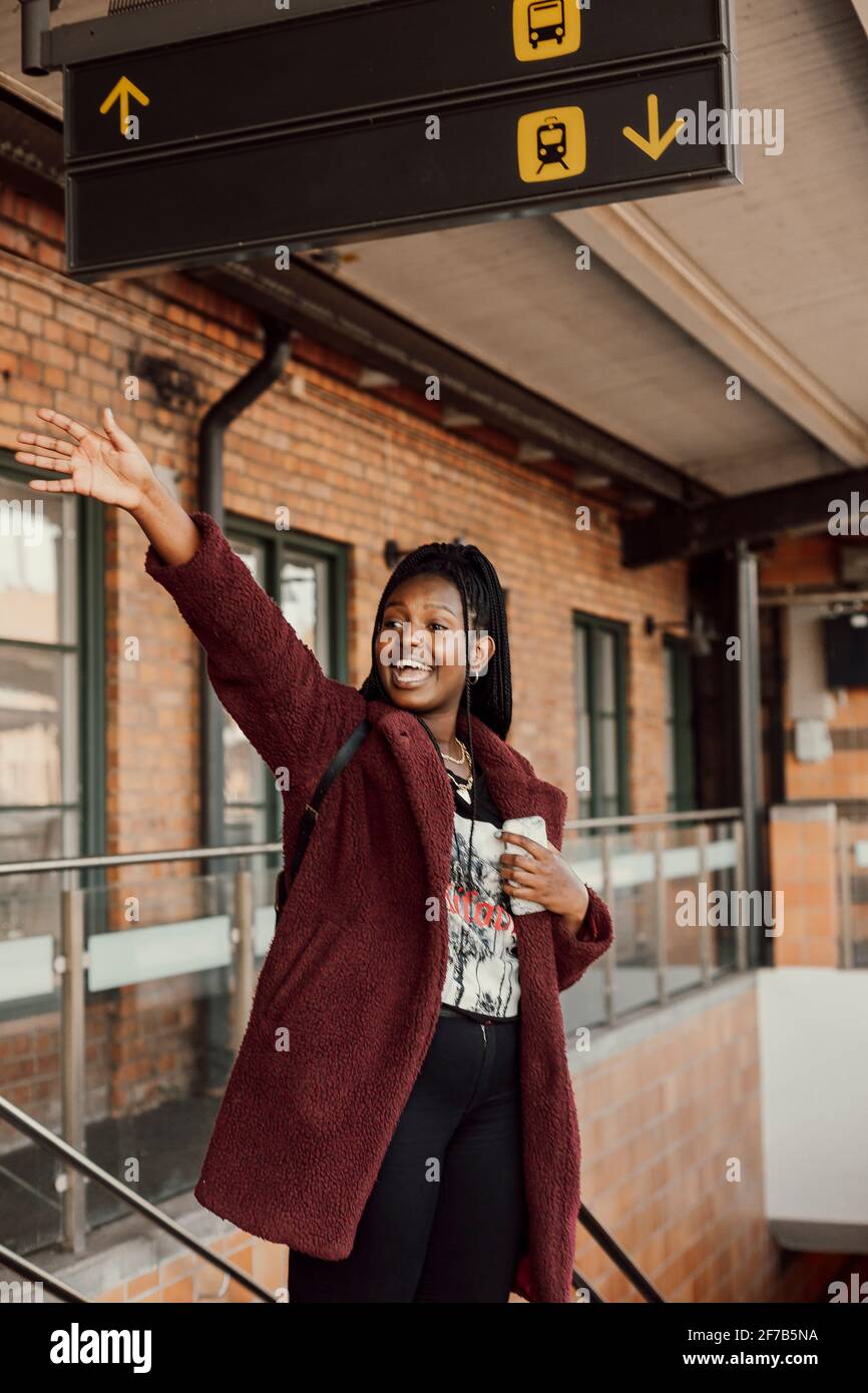Woman waving bus hi-res stock photography and images - Alamy