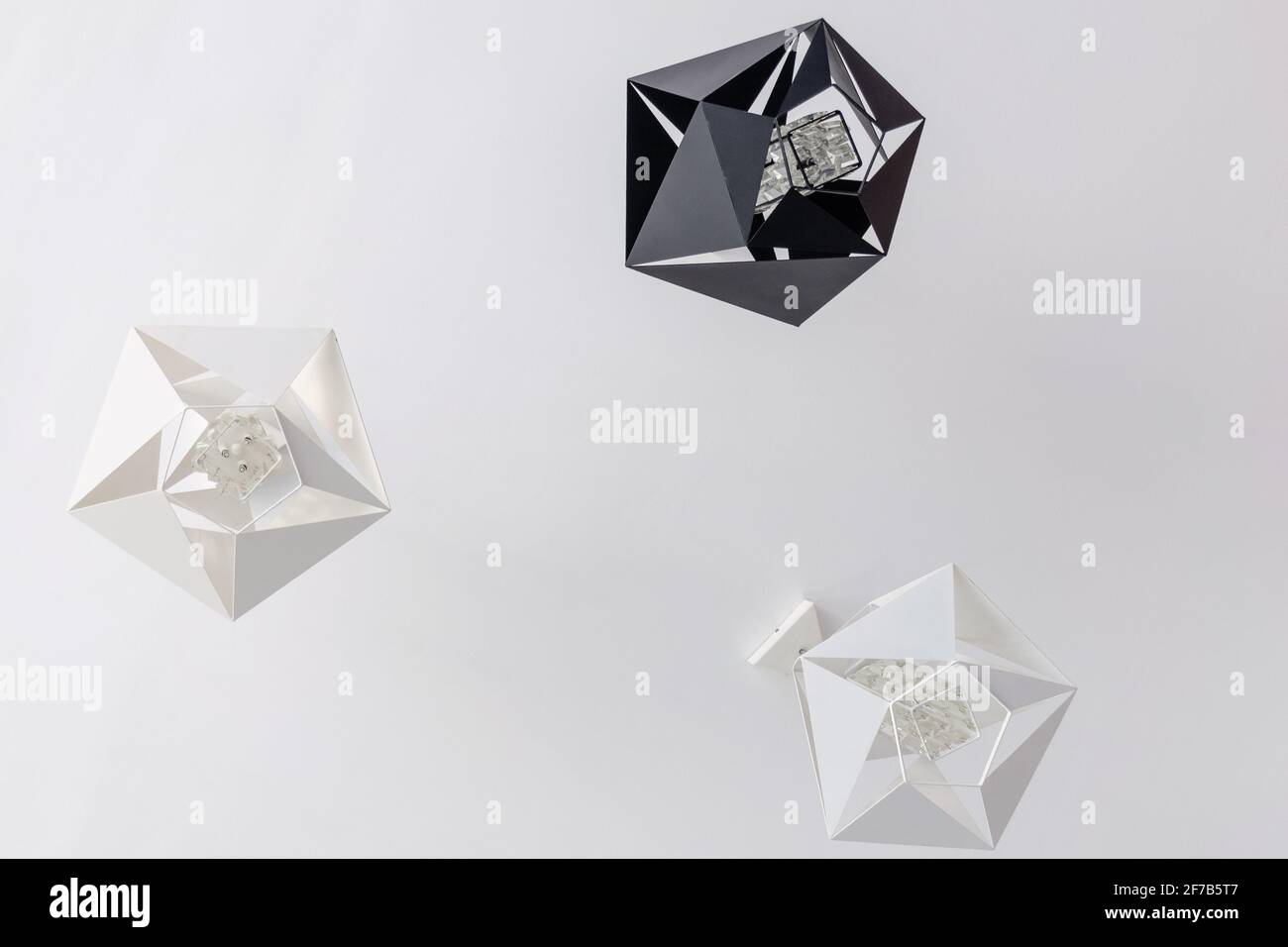 Modern pendant light hexagonal shape hanging from white ceiling Stock ...