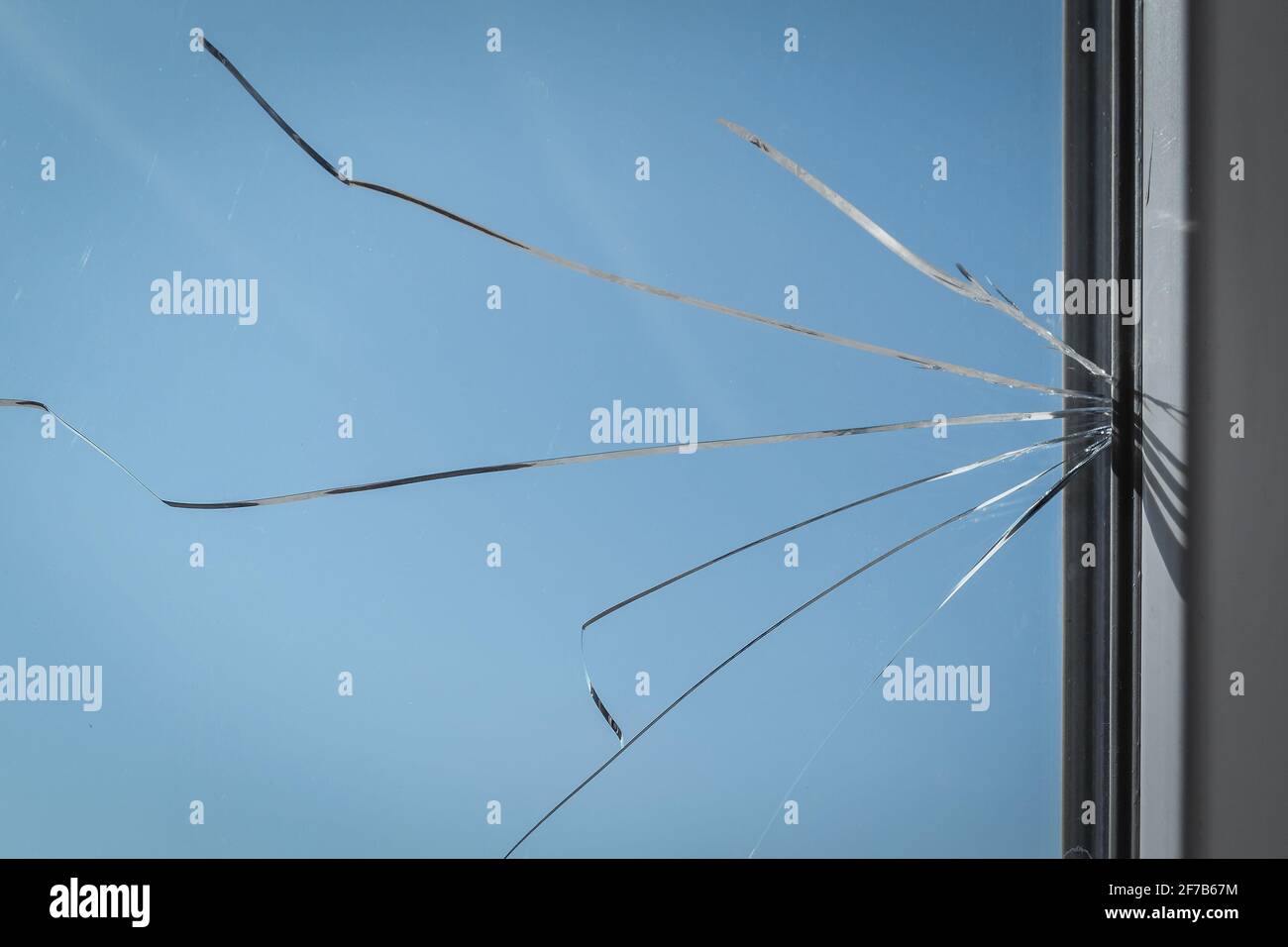 Cracked glass in the window frame of the house. Damaged window as a ...