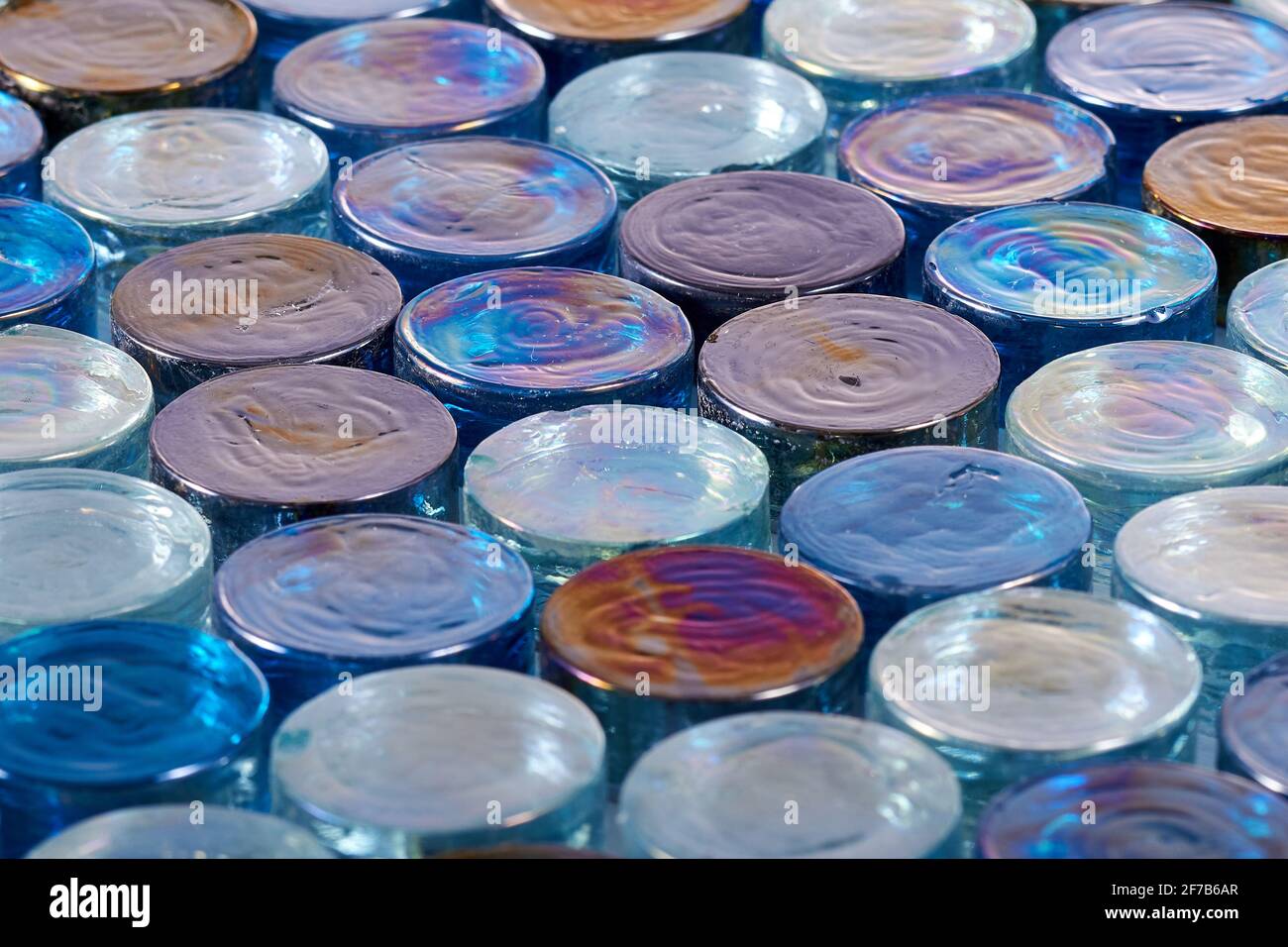 Glass tiles iridescent blue in a row multi-colored Stock Photo - Alamy