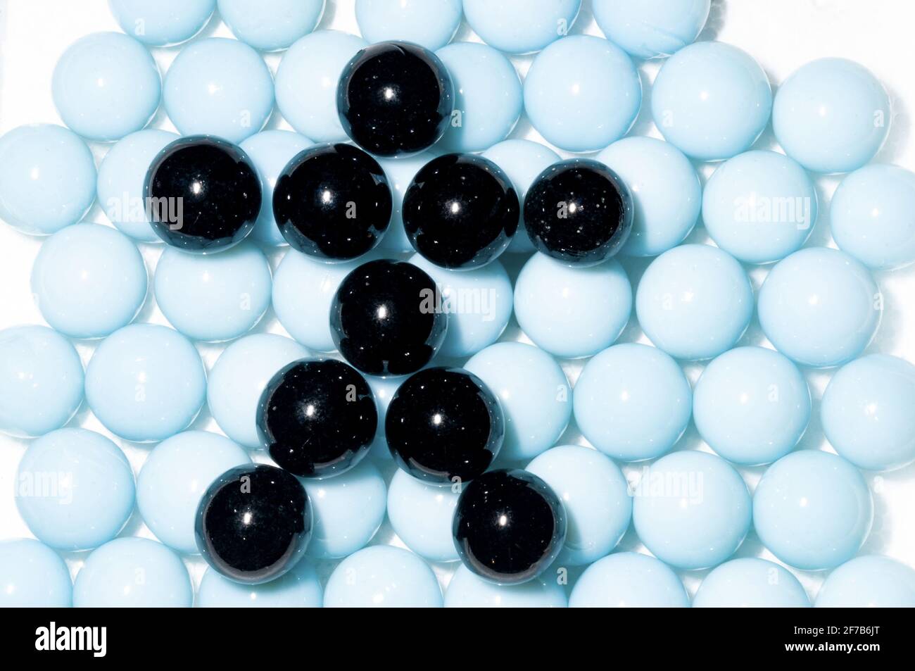 Black man shape in white glass spheres background Stock Photo - Alamy