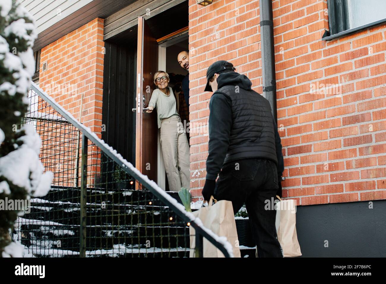 Man delivering shopping Stock Photo - Alamy
