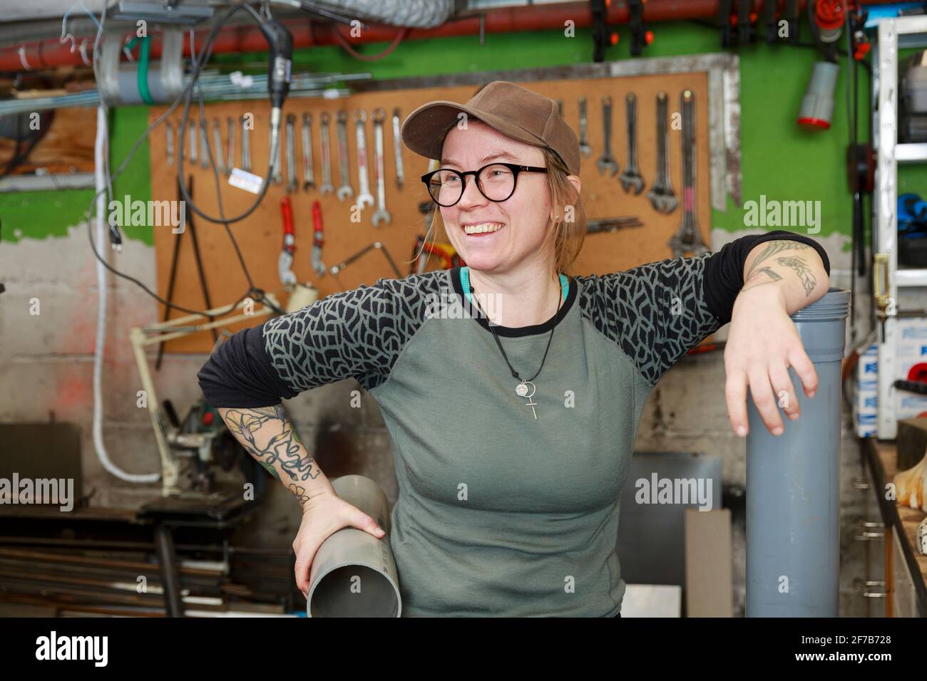 Female plumber working in workshop Stock Photo - Alamy