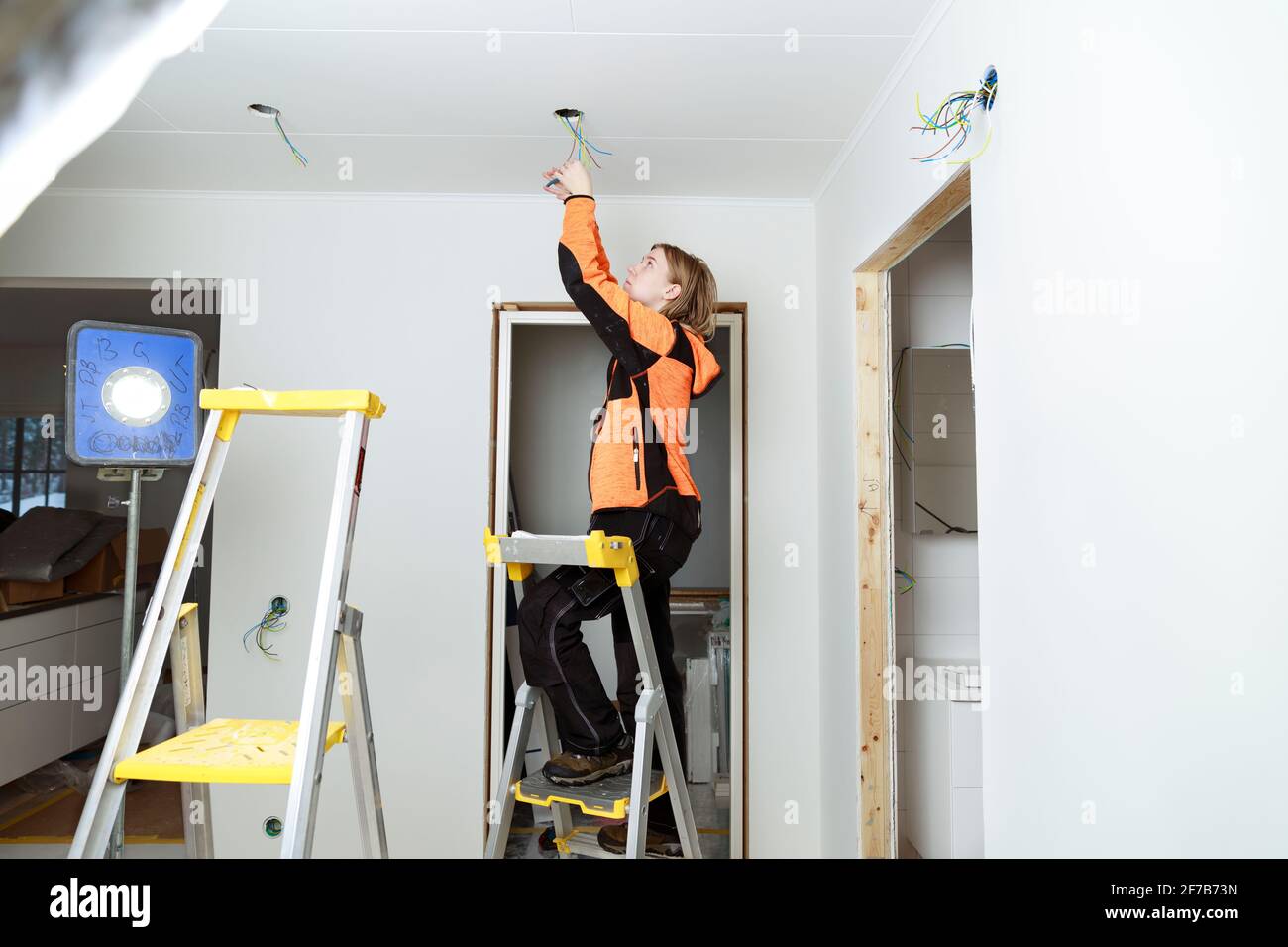 Young woman renovating house Stock Photo - Alamy