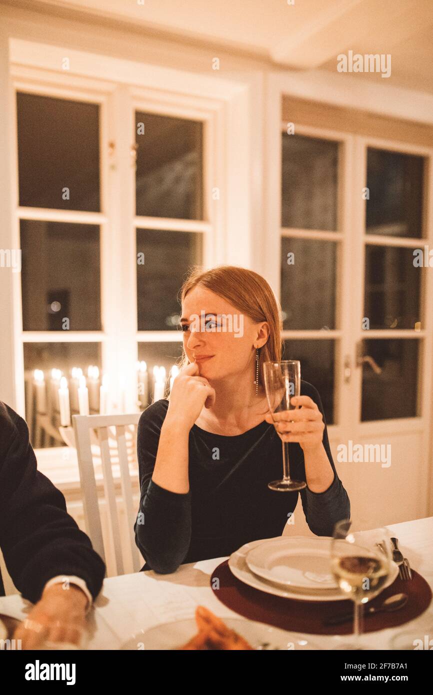 Sitting smiling holding looking away food and drink hi-res stock ...