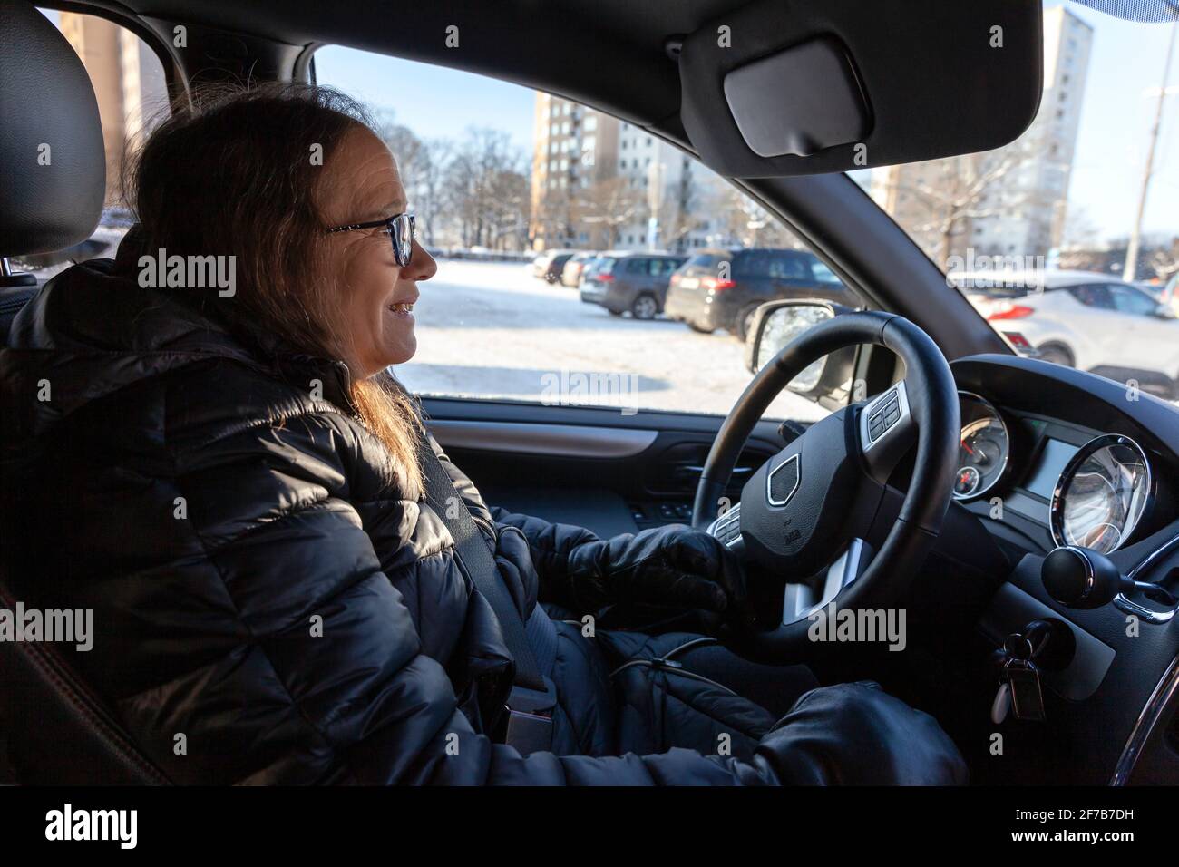 Senior woman driving Stock Photo - Alamy