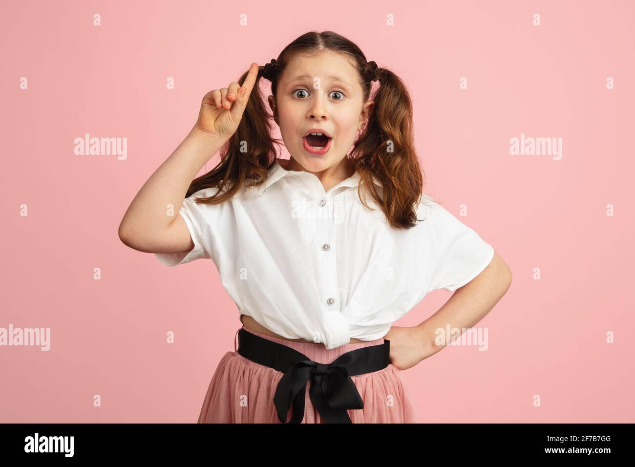 Pretty caucasian girl portrait isolated on pink studio background with copyspace Stock Photo - Alamy