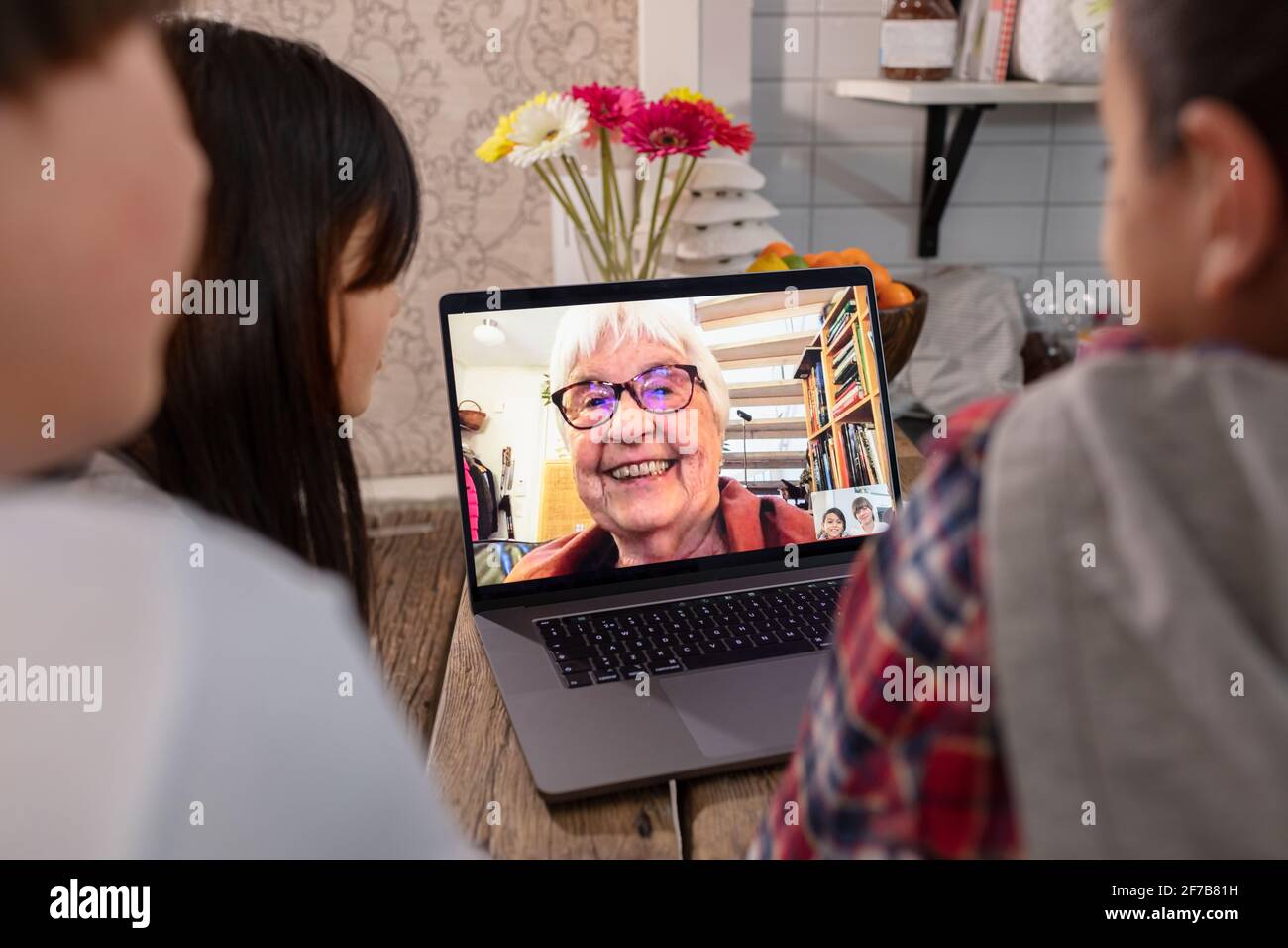 Grandchildren talking to grandmother via video call Stock Photo - Alamy