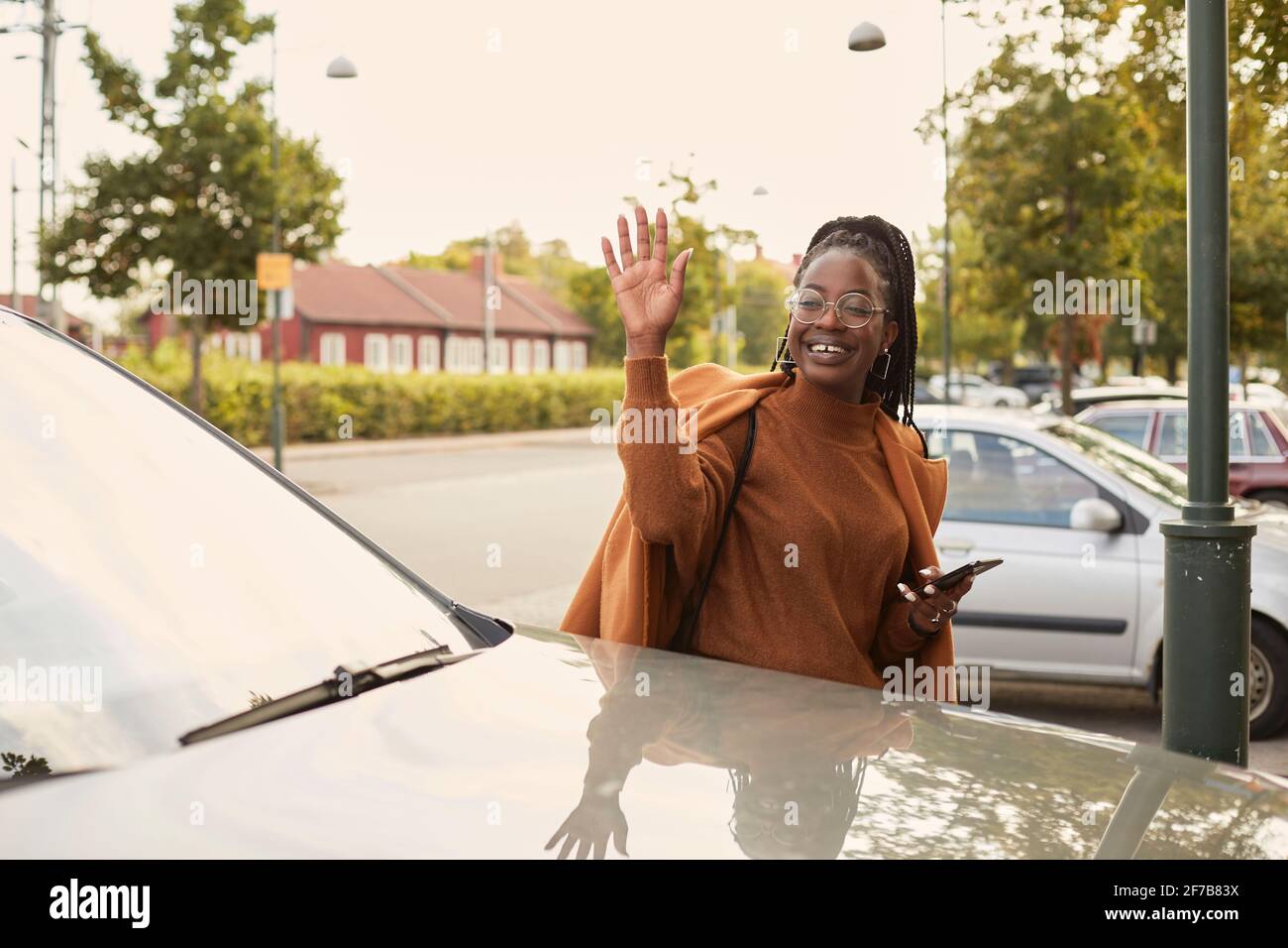 Waving standing smiling looking away hi-res stock photography and ...