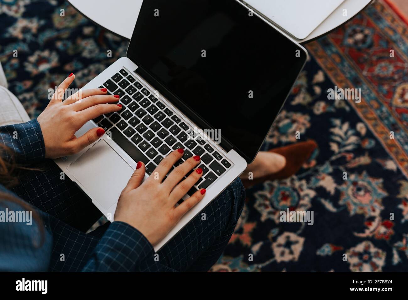 Woman's hands on laptop keyboard Stock Photo - Alamy